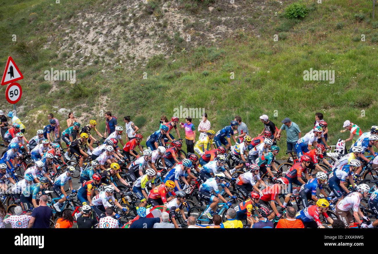 As cyclists navigate the lush slopes of the Basque Country, fans line ...