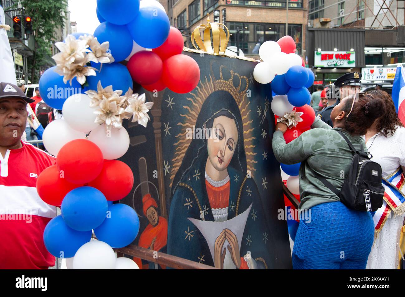 Dominican Day Parade: Group carries a portrait of the "Blessed Mary" in ...