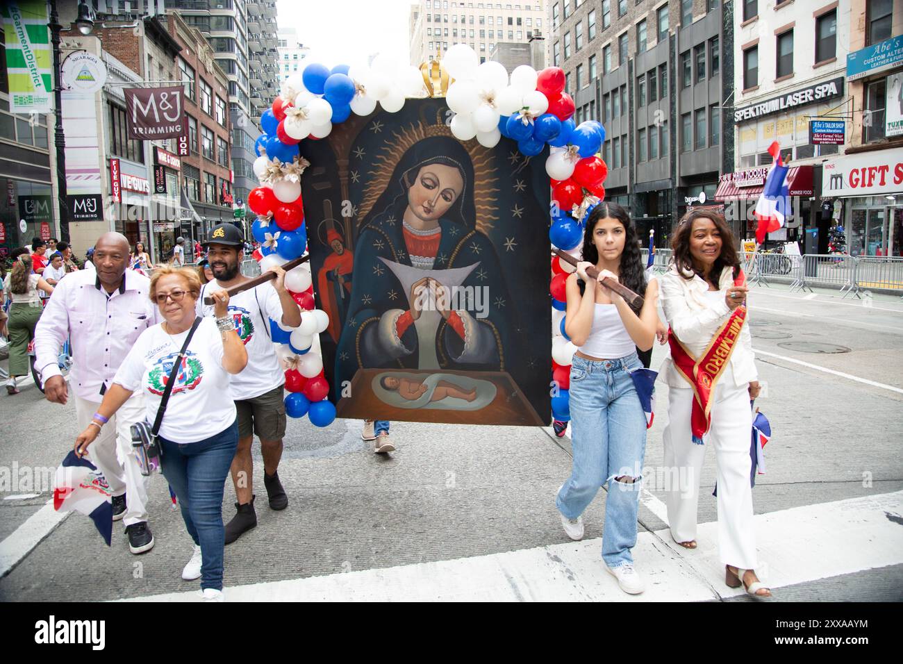 Dominican Day Parade: Group carries a portrait of the "Blessed Mary" in ...