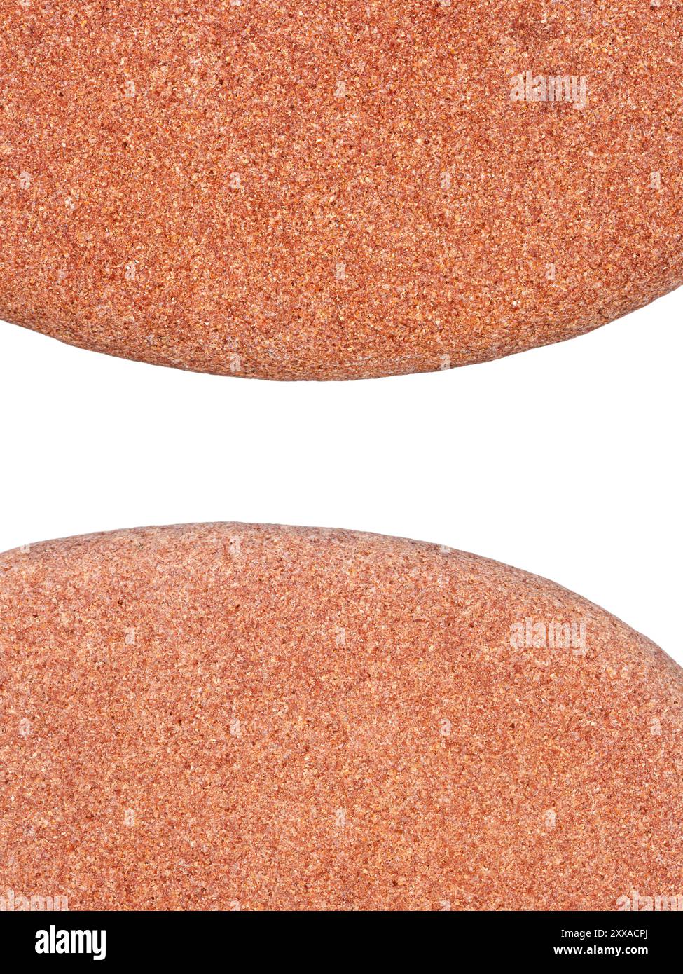 Edges of two pebbles isolated on white background with a space for text ...