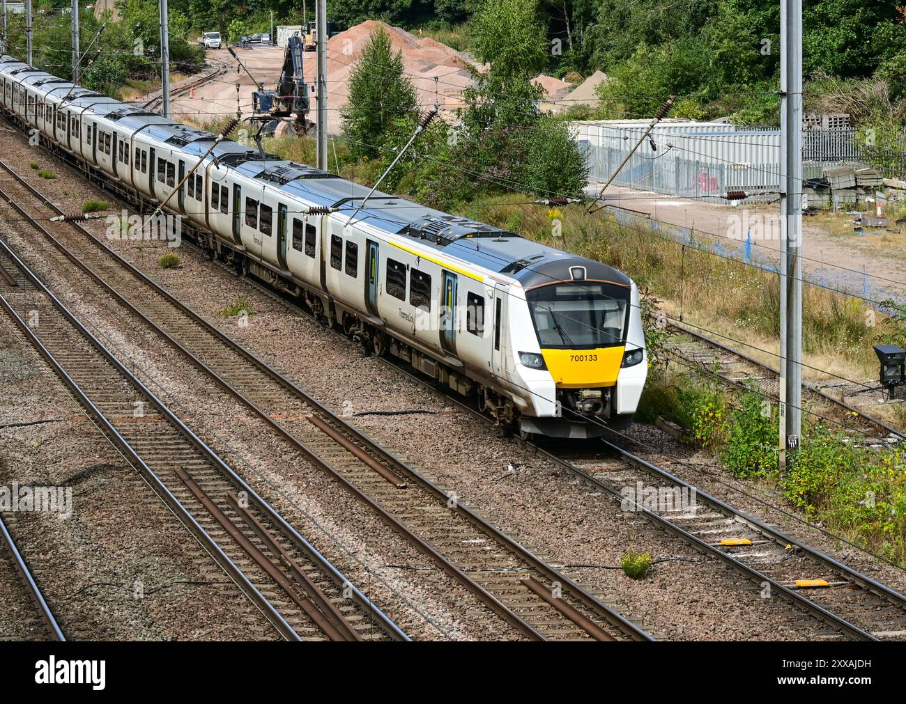 Class 700 EMU heads south from the station at Hitchin, Hertfordshire ...