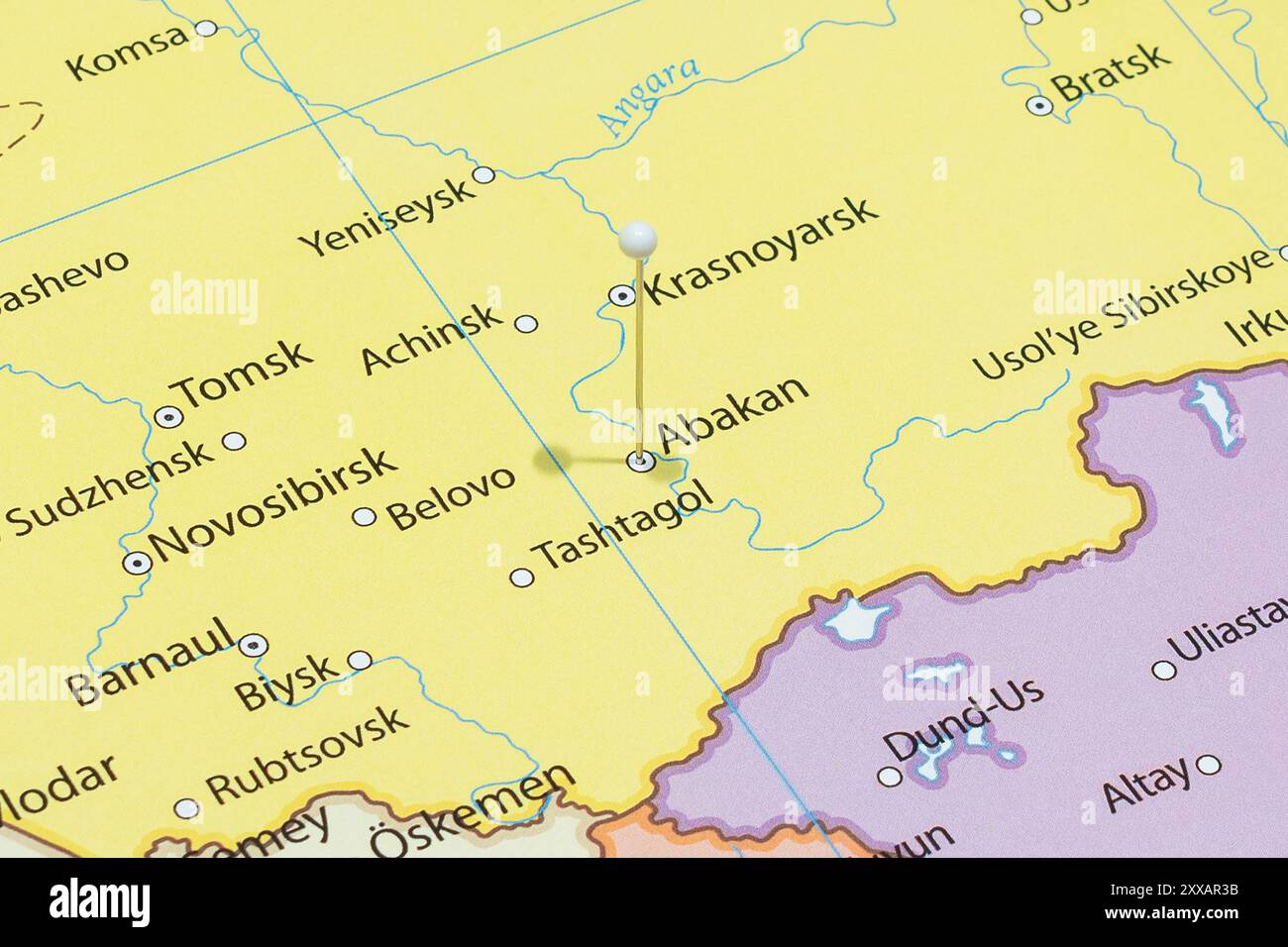 Close up to a Abakan city with a white pin needle into Russia country ...