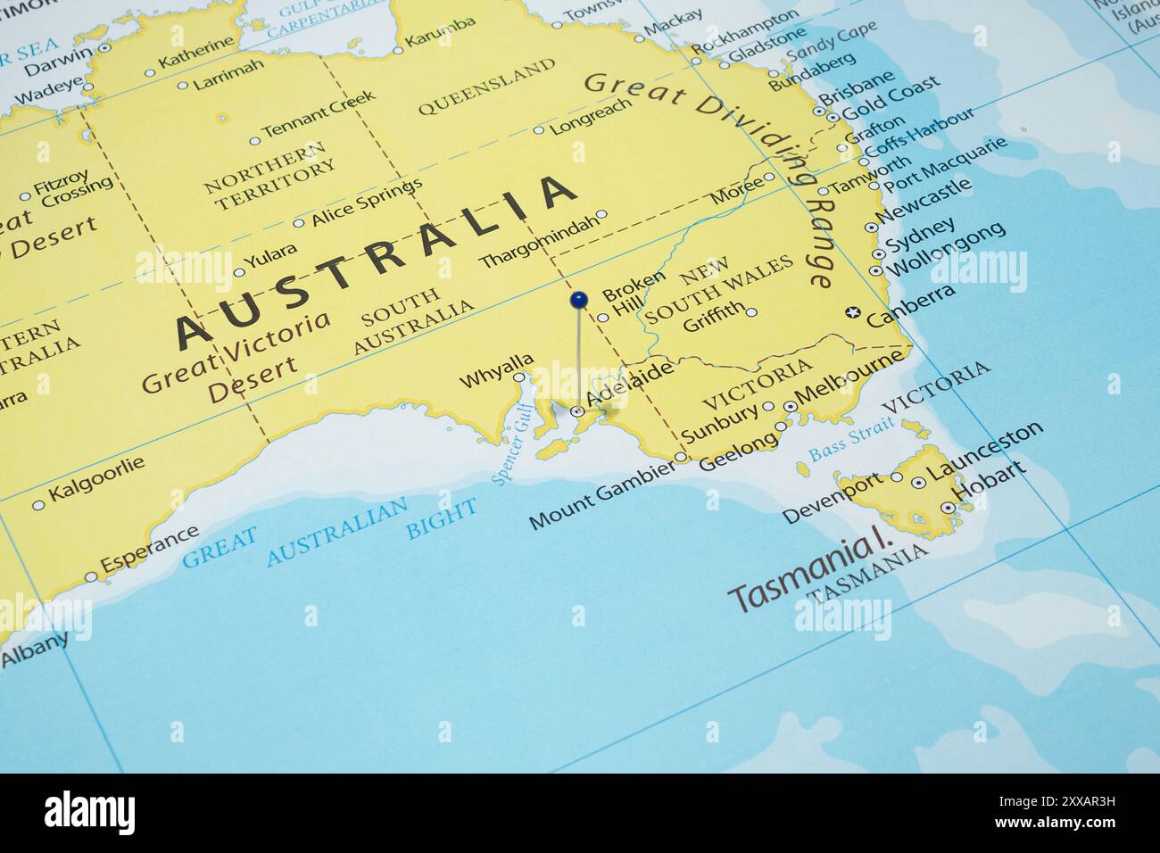 Close up to a Adelaide city with a blue pin needle into Australia ...