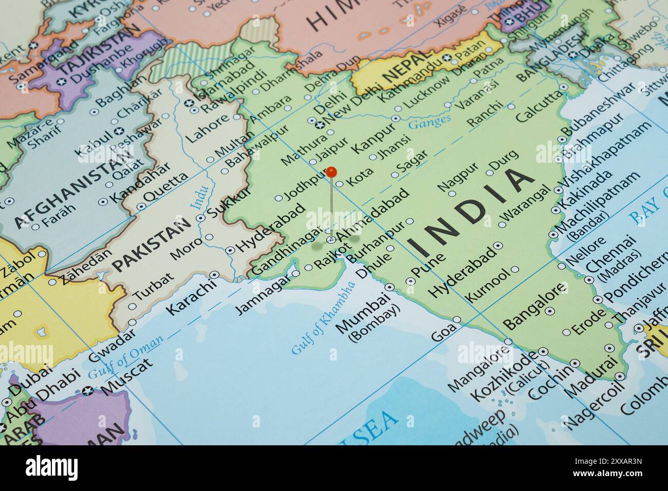 Close up to a Ahmadabad city with an orange pin needle into India ...