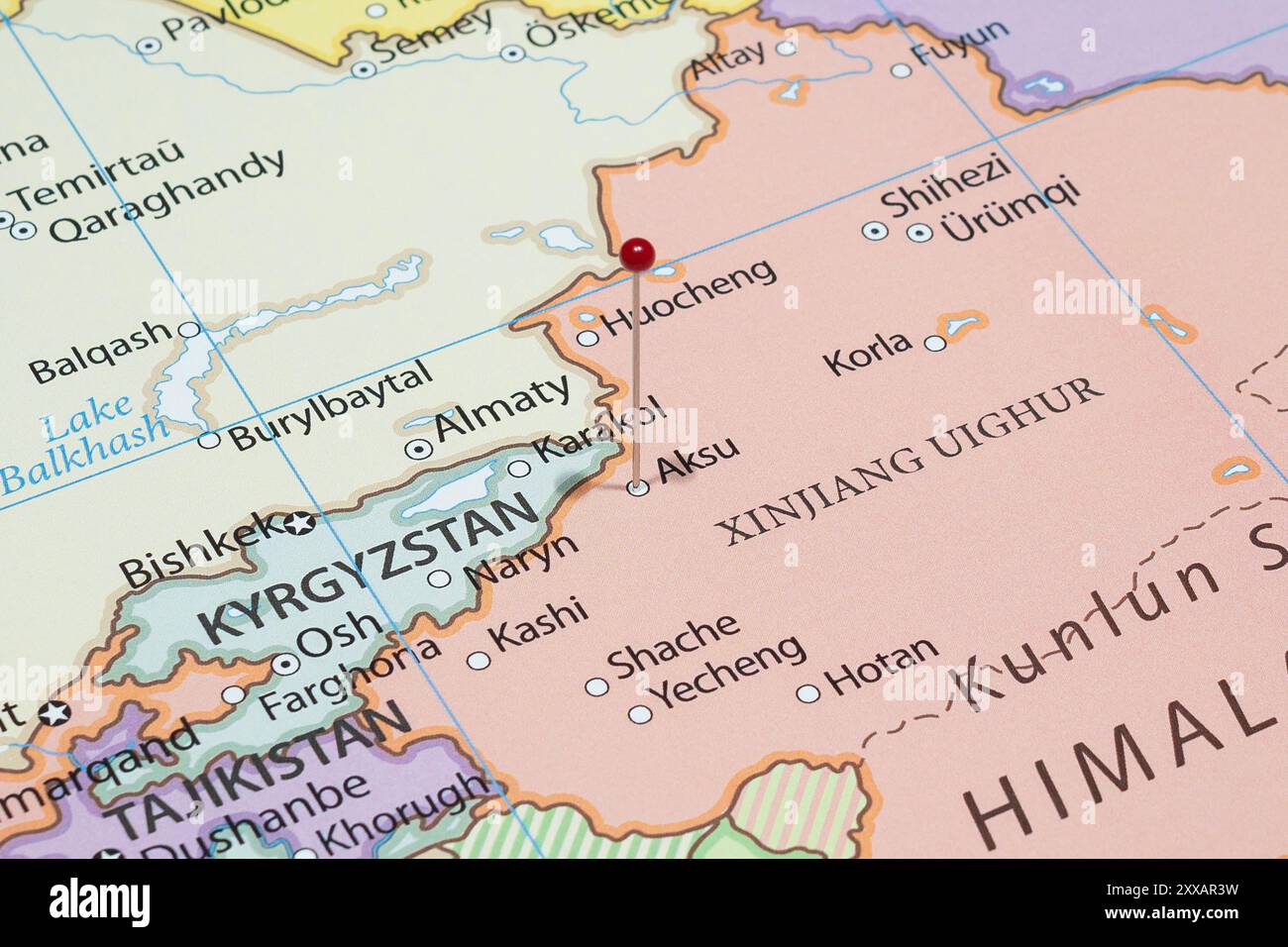 Close up to a Aksu city with a red pin needle into China country ...
