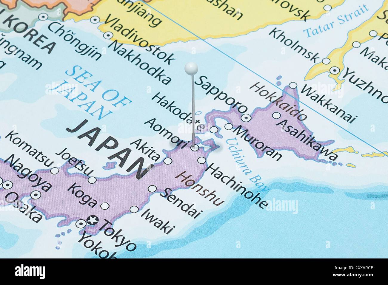Close up to a Aomori city with a white pin needle into Japan country ...