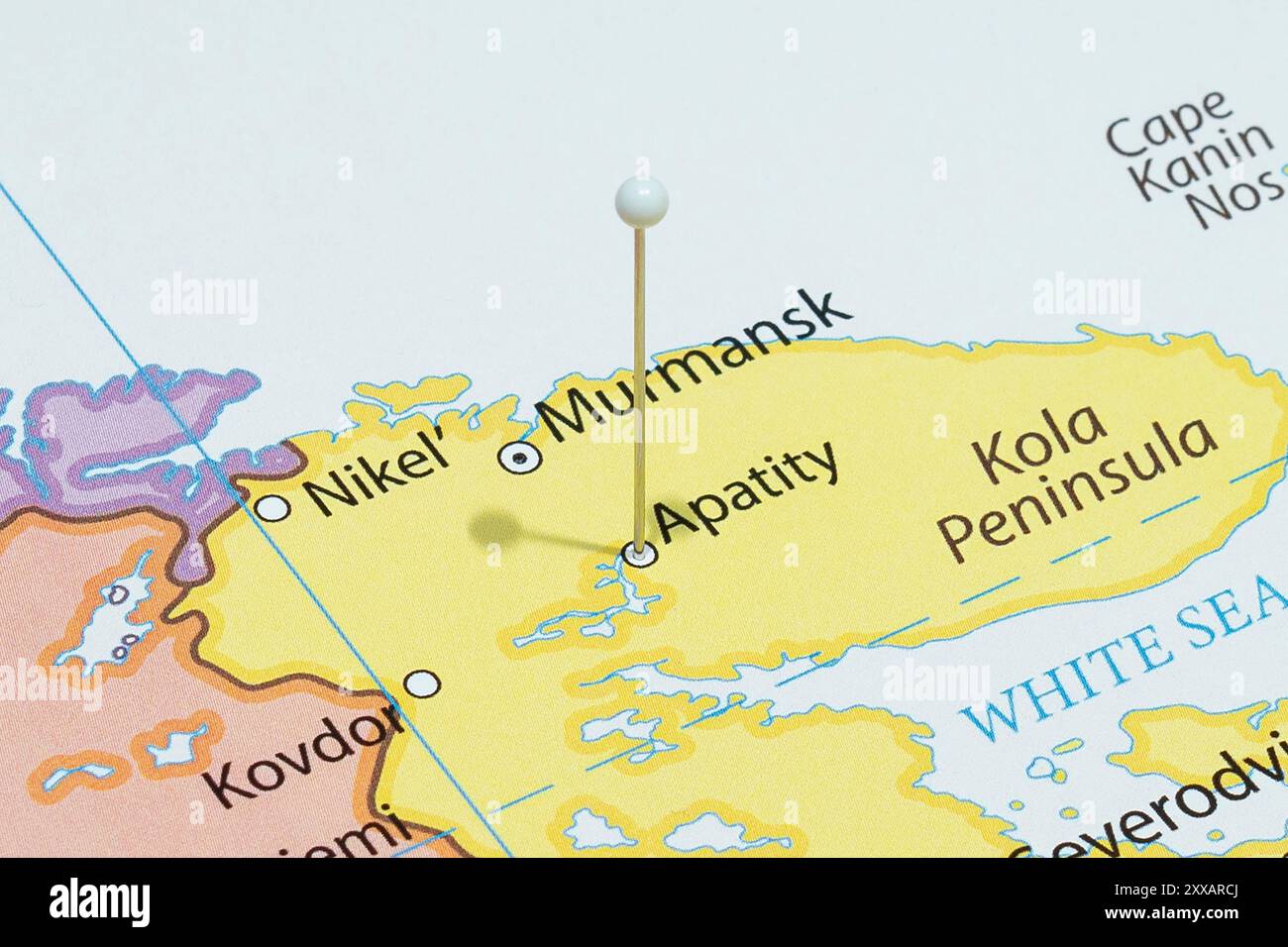 Close up to a Apatity city with a white pin needle into Russia country ...