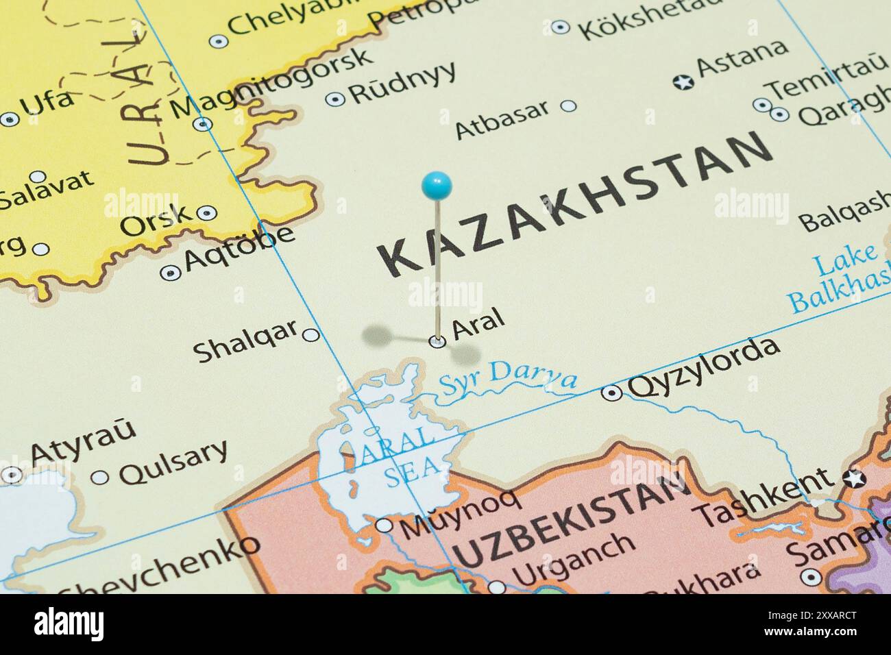 Close up to a Aral city with a light blue pin needle into Kazakhstan ...
