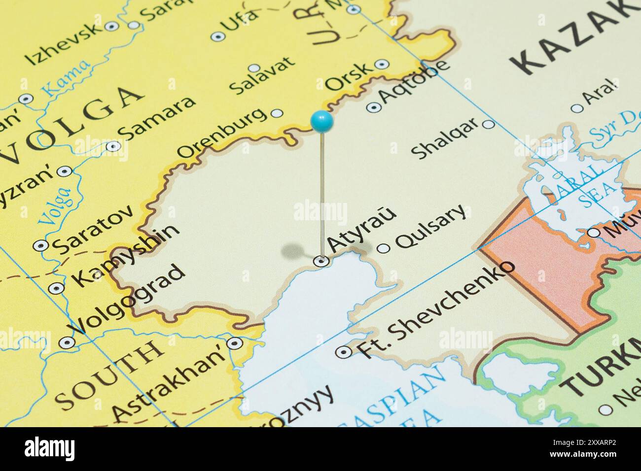 Close up to a Atyrau city with a light blue pin needle into Kazakhstan ...