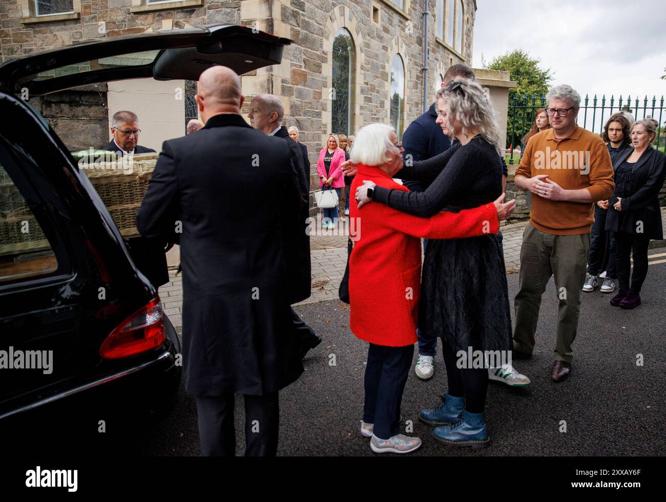 The coffin carrying Nell McCafferty is carried from St. Columba's ...