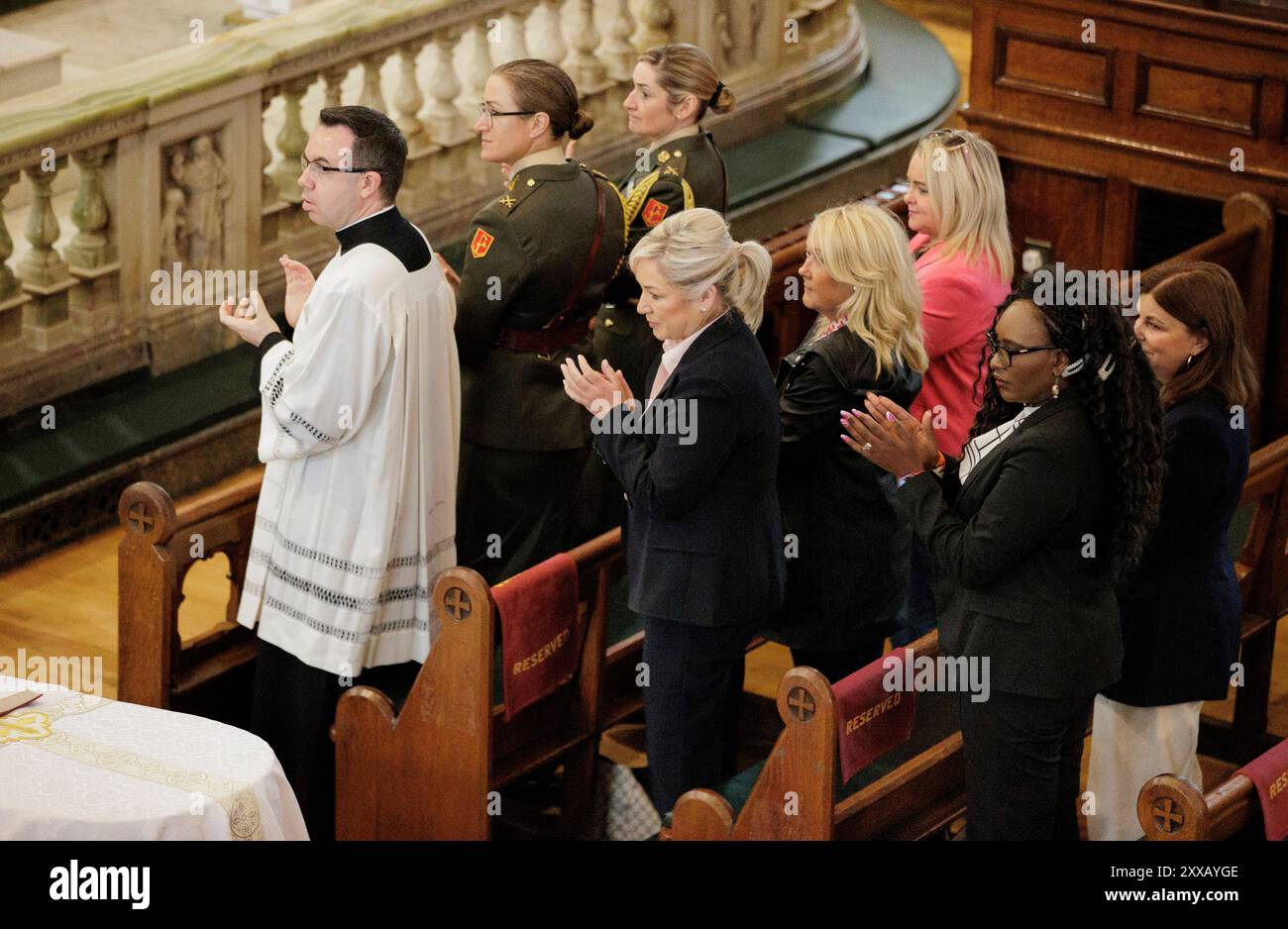 First Minister Michelle O’Neill (centre) with dignitaries applaud ...