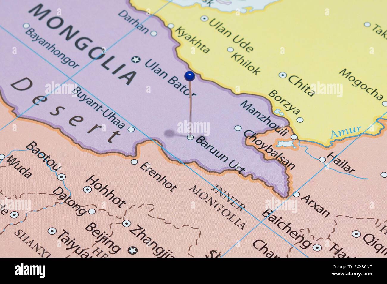 Close up to a Baruun Urt city with a blue pin needle into Mongolia ...