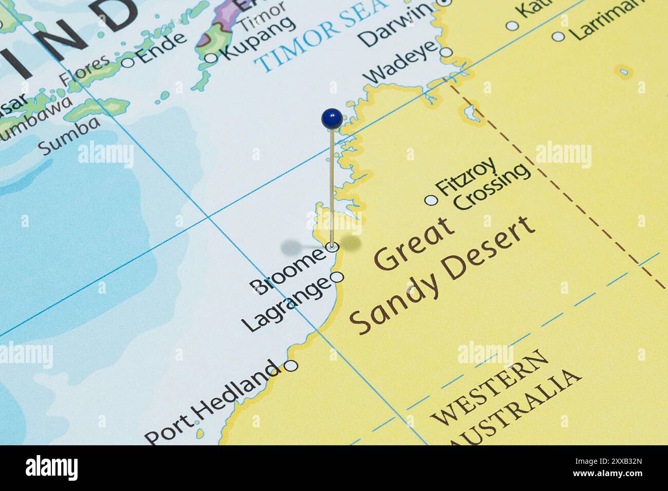 Close up to a Broome city with a blue pin needle into Australia country ...