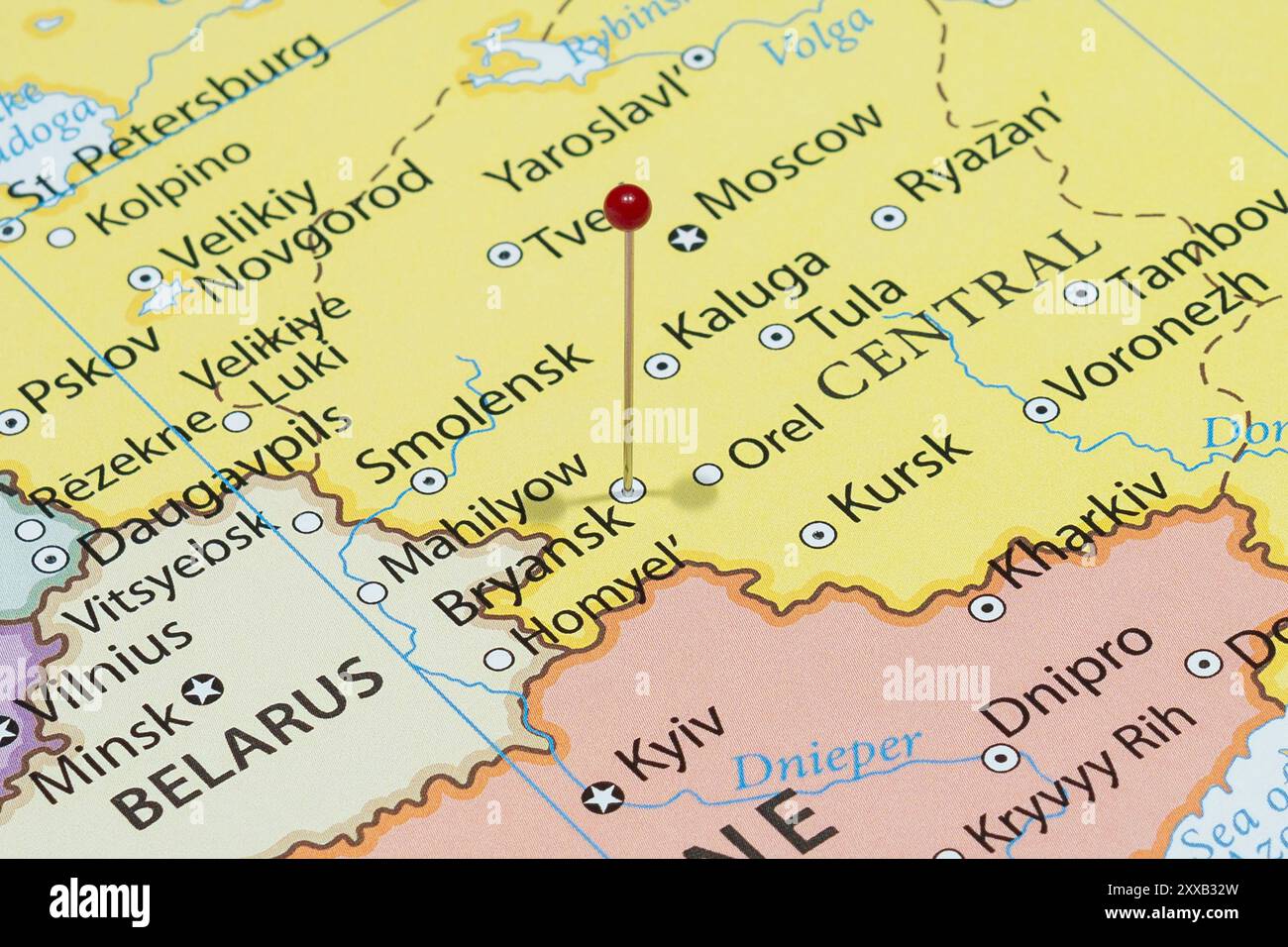 Close up to a Bryansk city with a red pin needle into Russia country ...