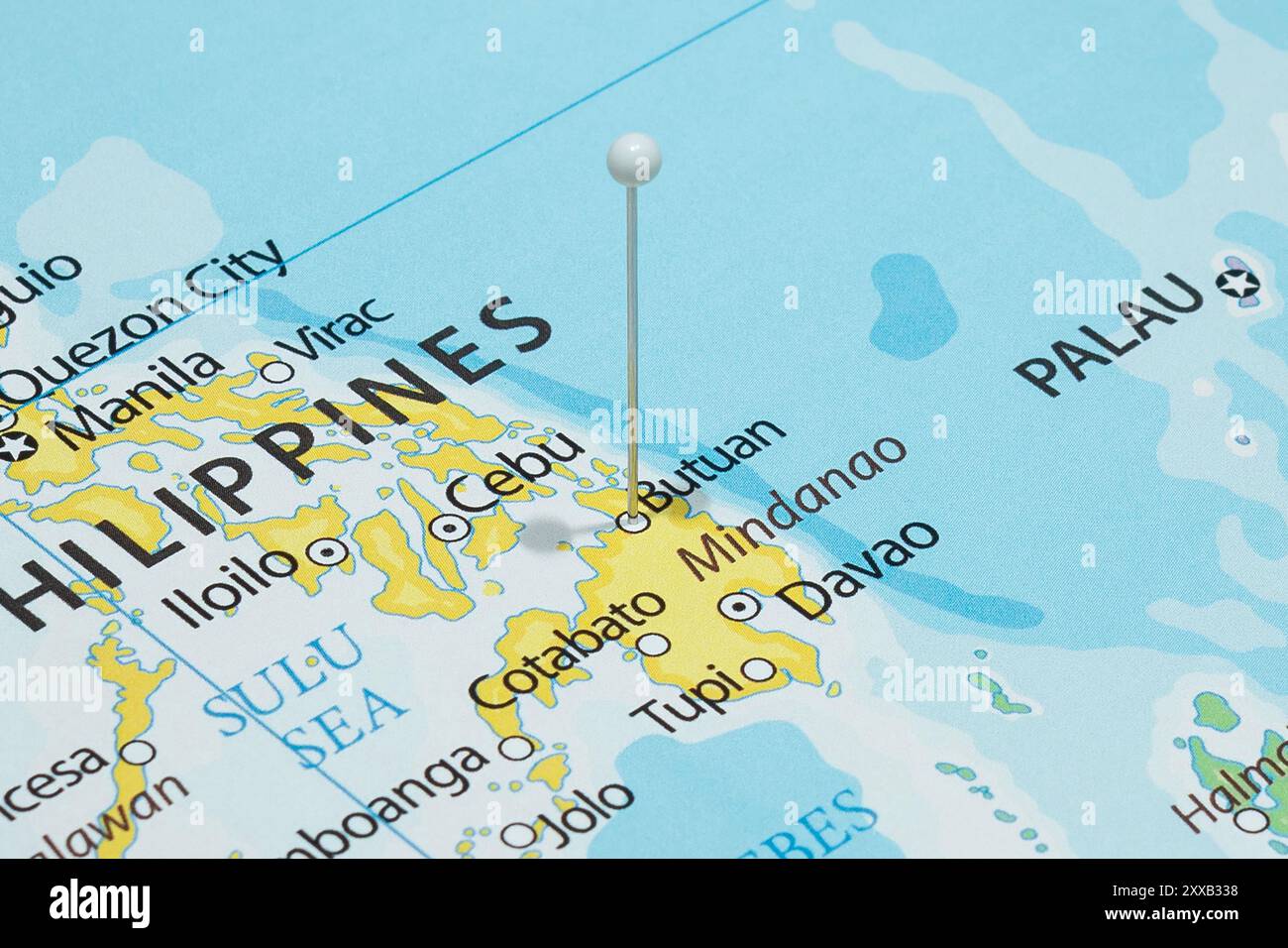 Close up to a Butuan city with a white pin needle into Philippines ...