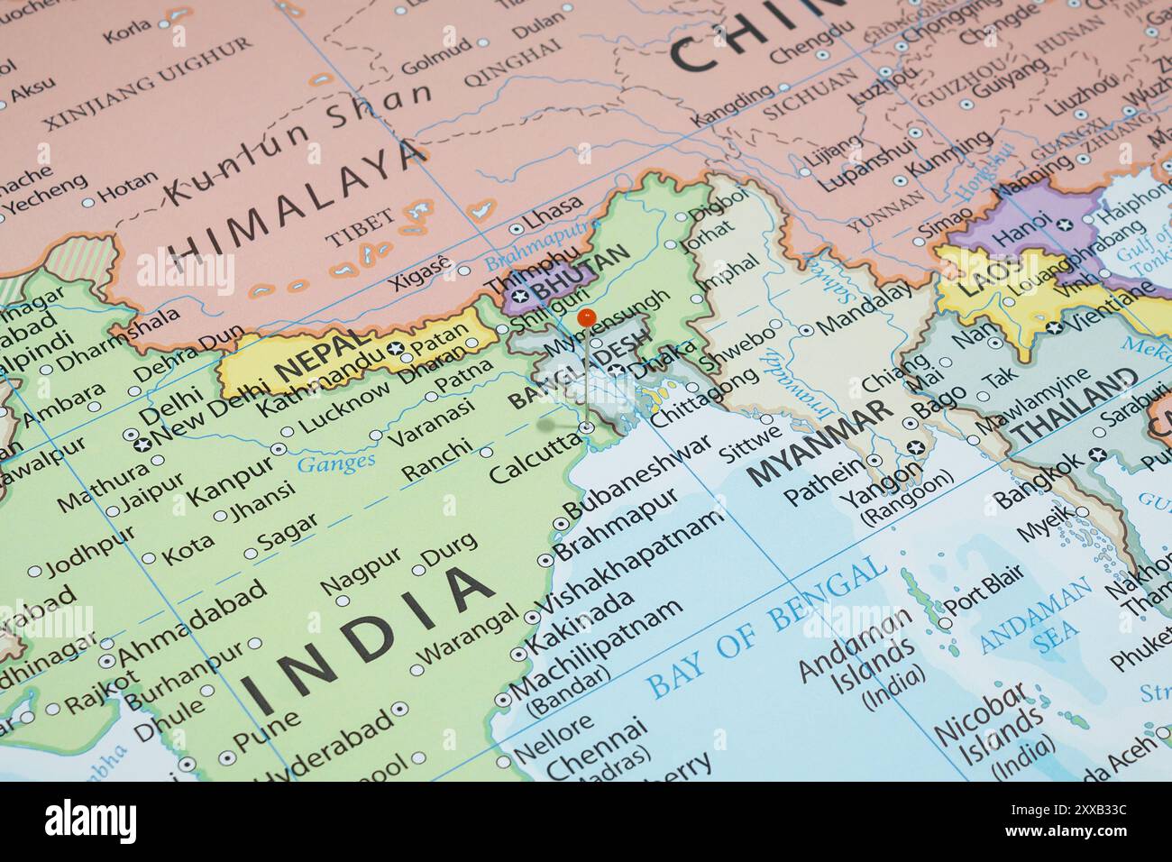 Close up to a Calcutta city with an orange pin needle into India ...