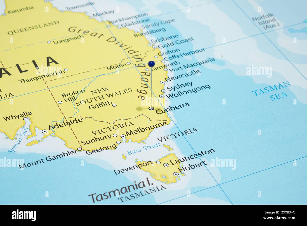 Macro photo of Canberra city with a blue pin needle into Australia ...