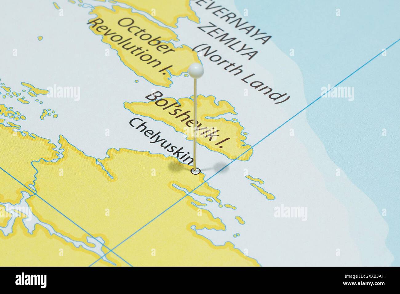 Close up to a Cape Chelyuskin city with a white pin needle into Russia ...