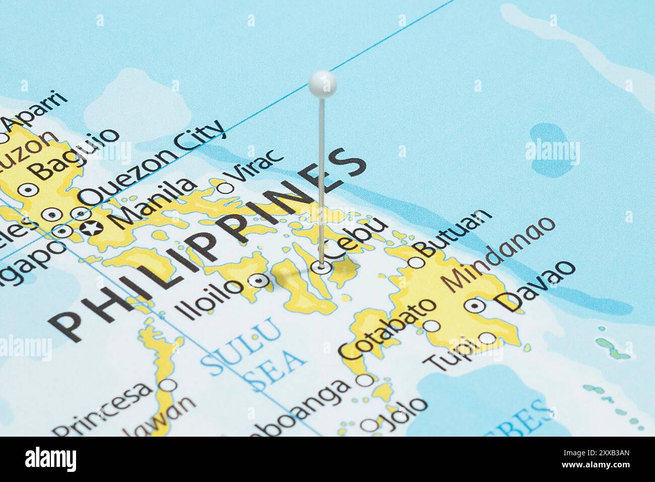 Close up to a Cebu city with a white pin needle into Philippines ...