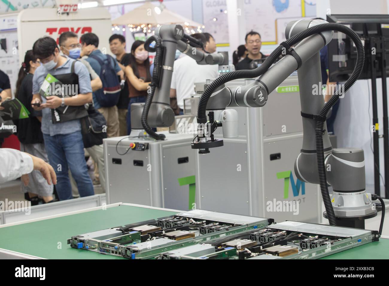 People visit robotical arm of TAMAI COBOT during Artificial ...