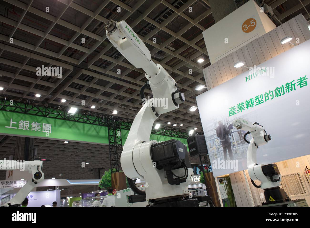 People visit robotical arm of HIWIN during the Artificial Intelligence ...