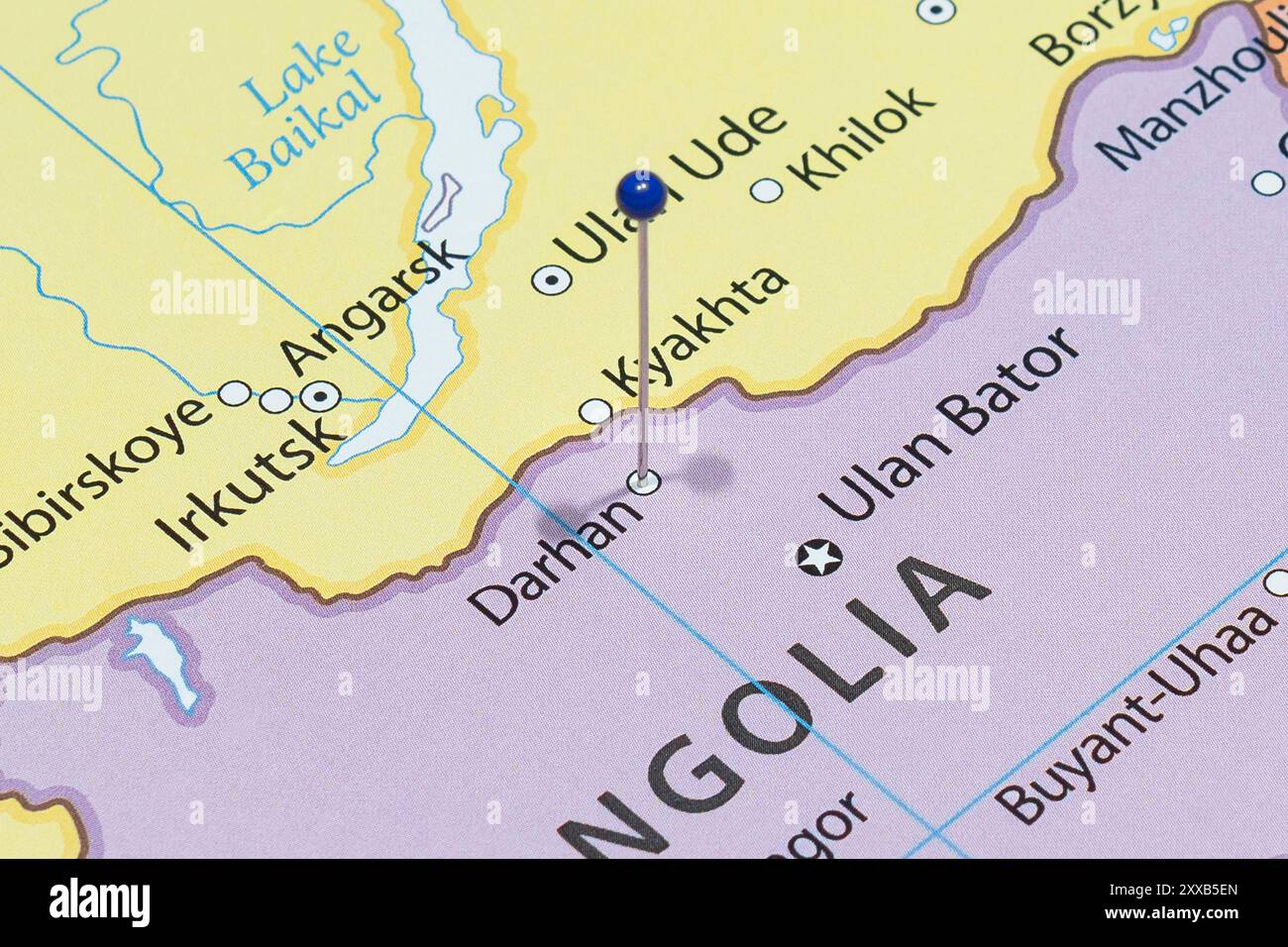 Close up to a Darkhan city with a blue pin needle into Mongolia country ...