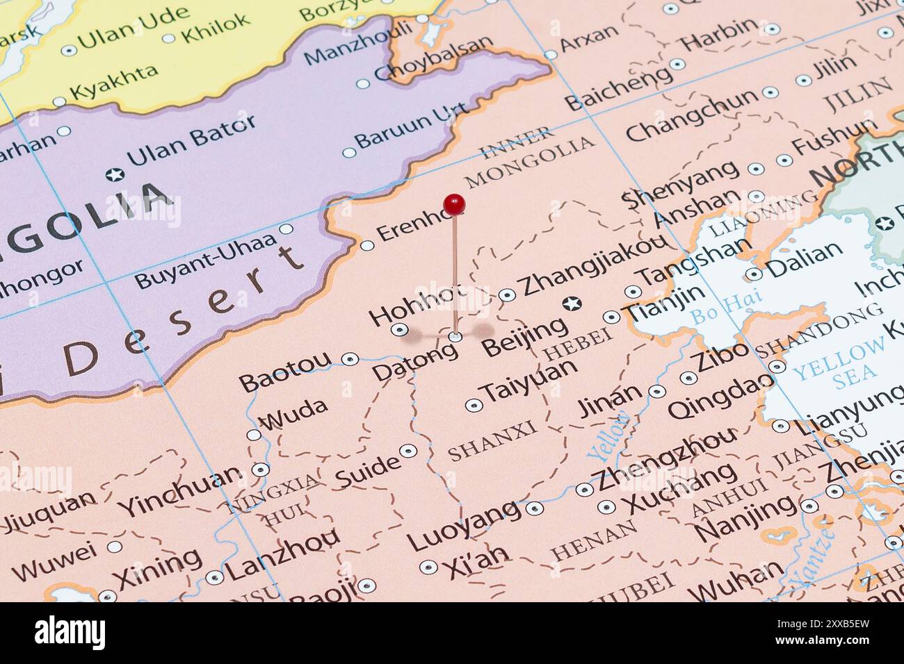 Close up to a Datong city with a red pin needle into China country ...