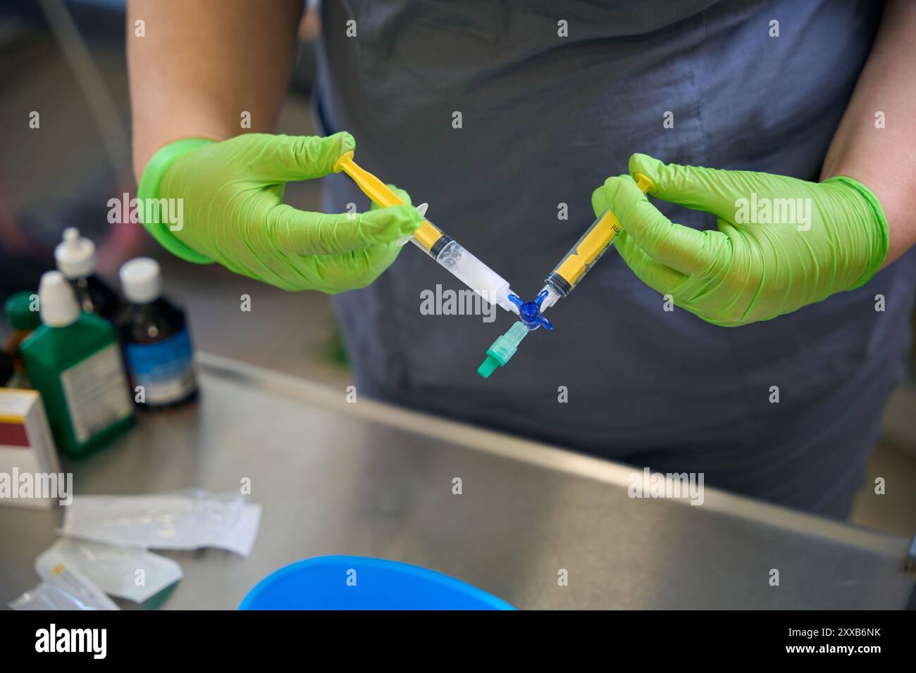 Health worker prepares a syringe with medicine for injection Stock ...