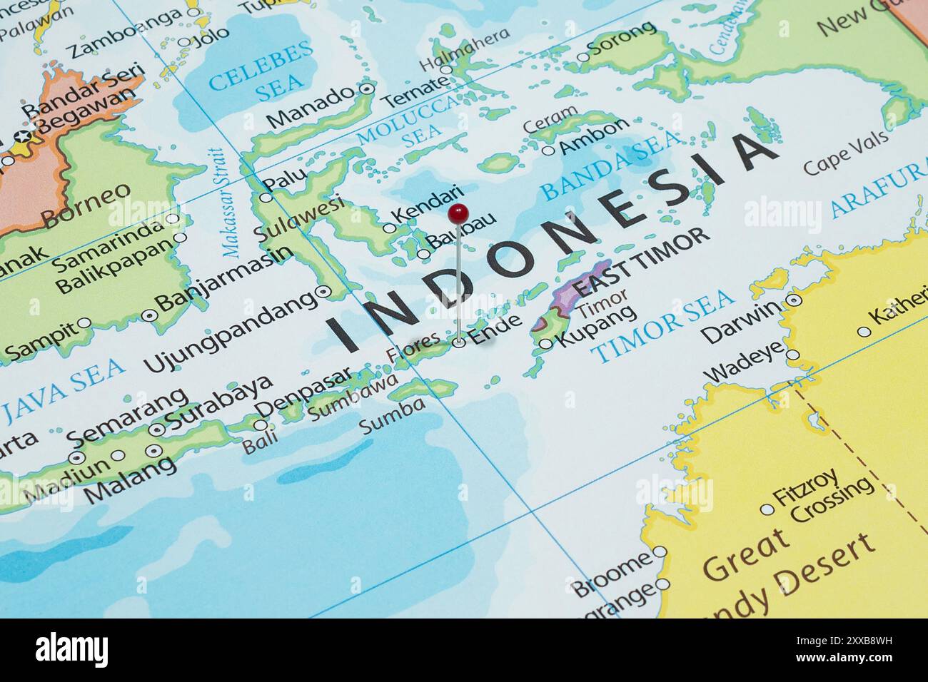 Close up to a Ende city with a red pin needle into Indonesia country ...