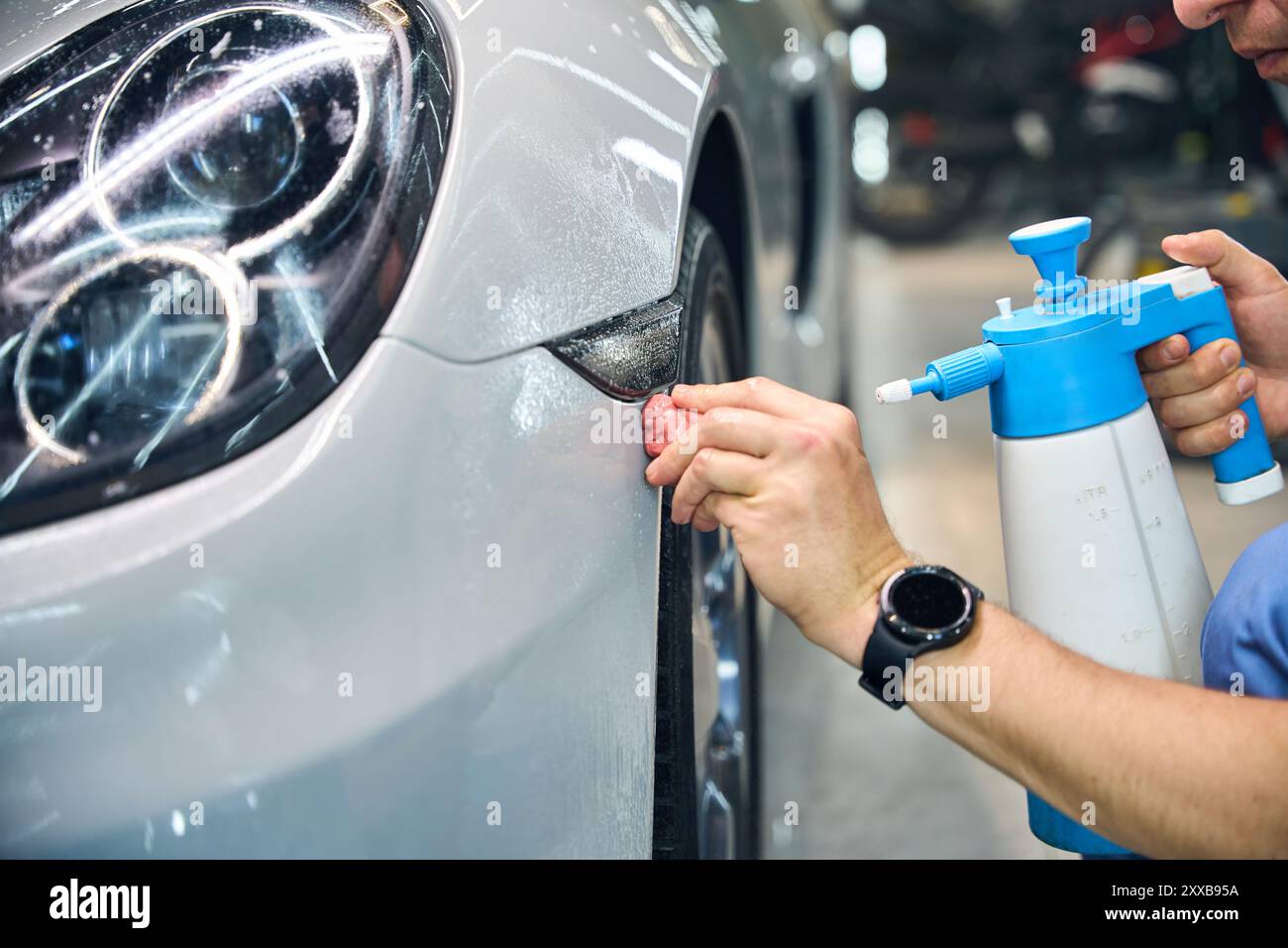 Worker uses special materials in process of detailing a car Stock Photo ...