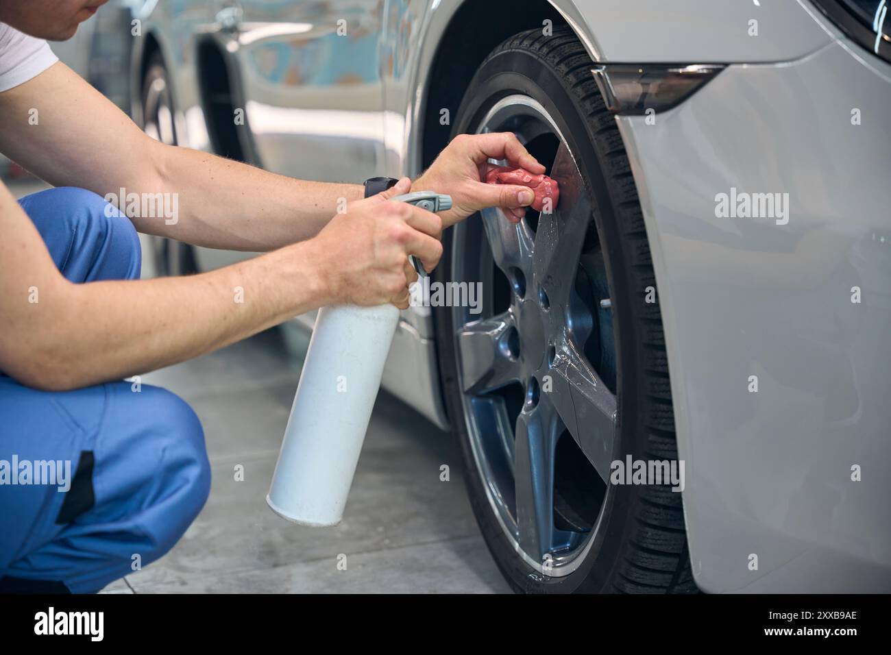 Specialist uses special devices in the process of car detailing Stock ...