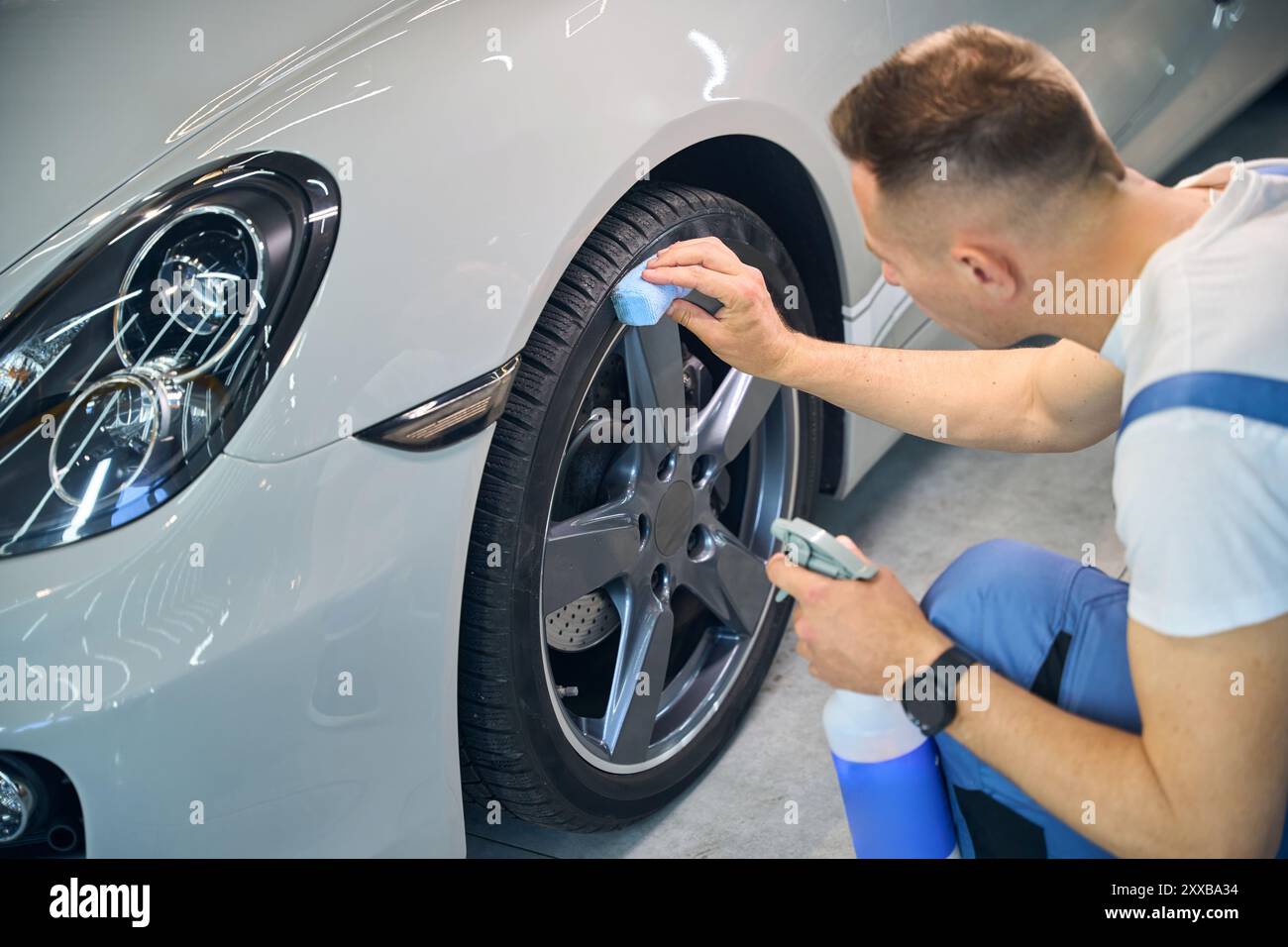 Car service personnel use special materials in car detailing process ...