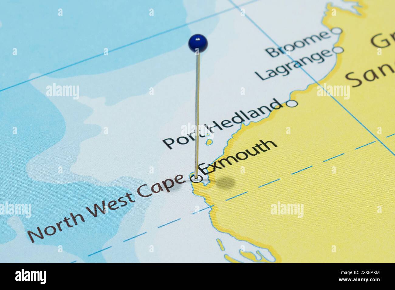 Close up to a Exmouth city with a blue pin needle into Australia ...