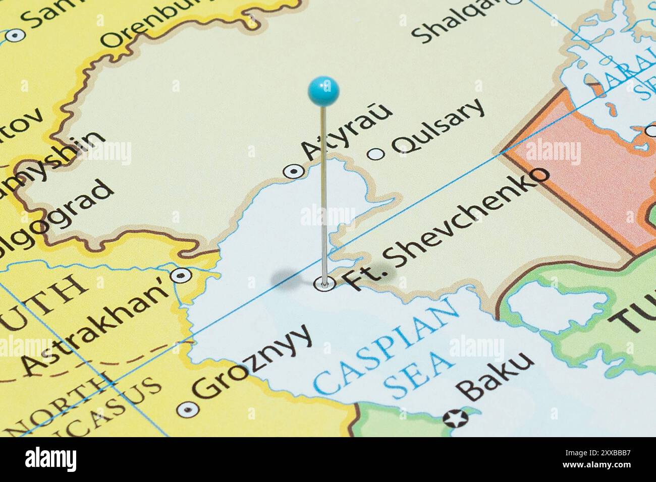 Close up to a Fort Shevchenko city with a light blue pin needle into ...