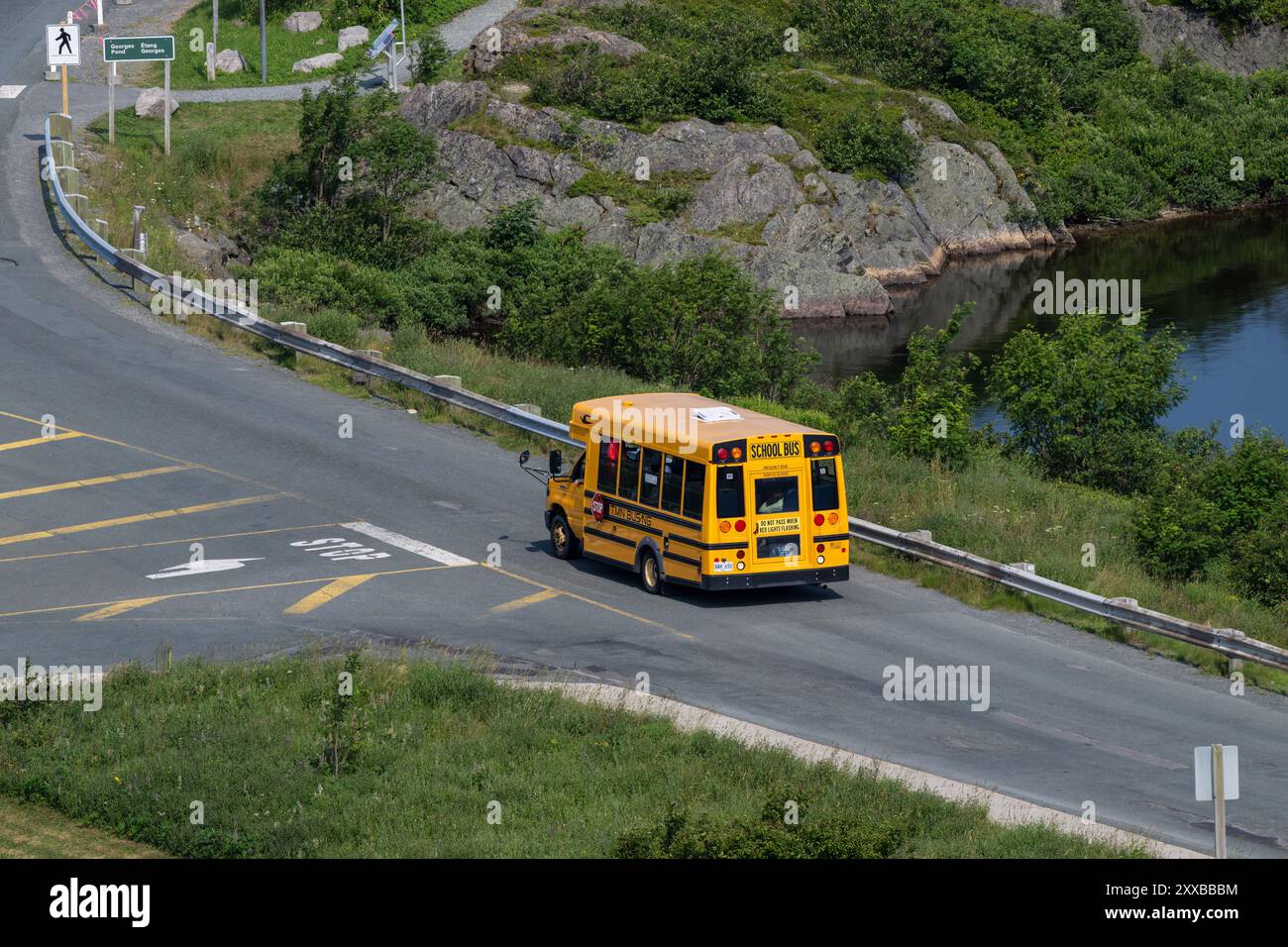 Closeup view of school bus driving on Signal Hill, St. John’s ...