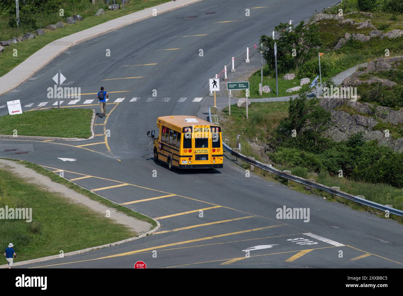 Closeup view of school bus driving on Signal Hill, St. John’s ...