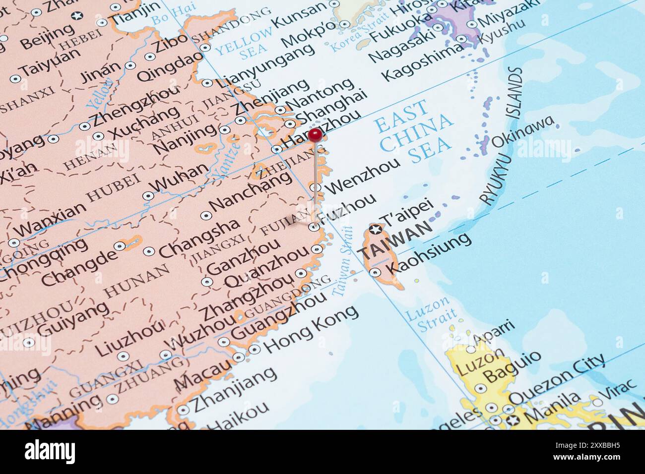 Close up to a Fuzhou city with a red pin needle into China country ...