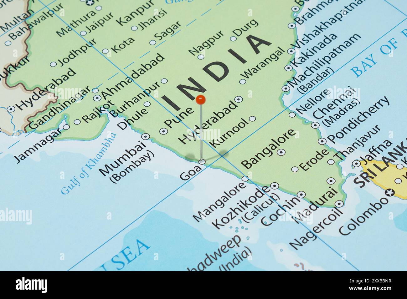 Close up to a Goa city with an orange pin needle into India country ...