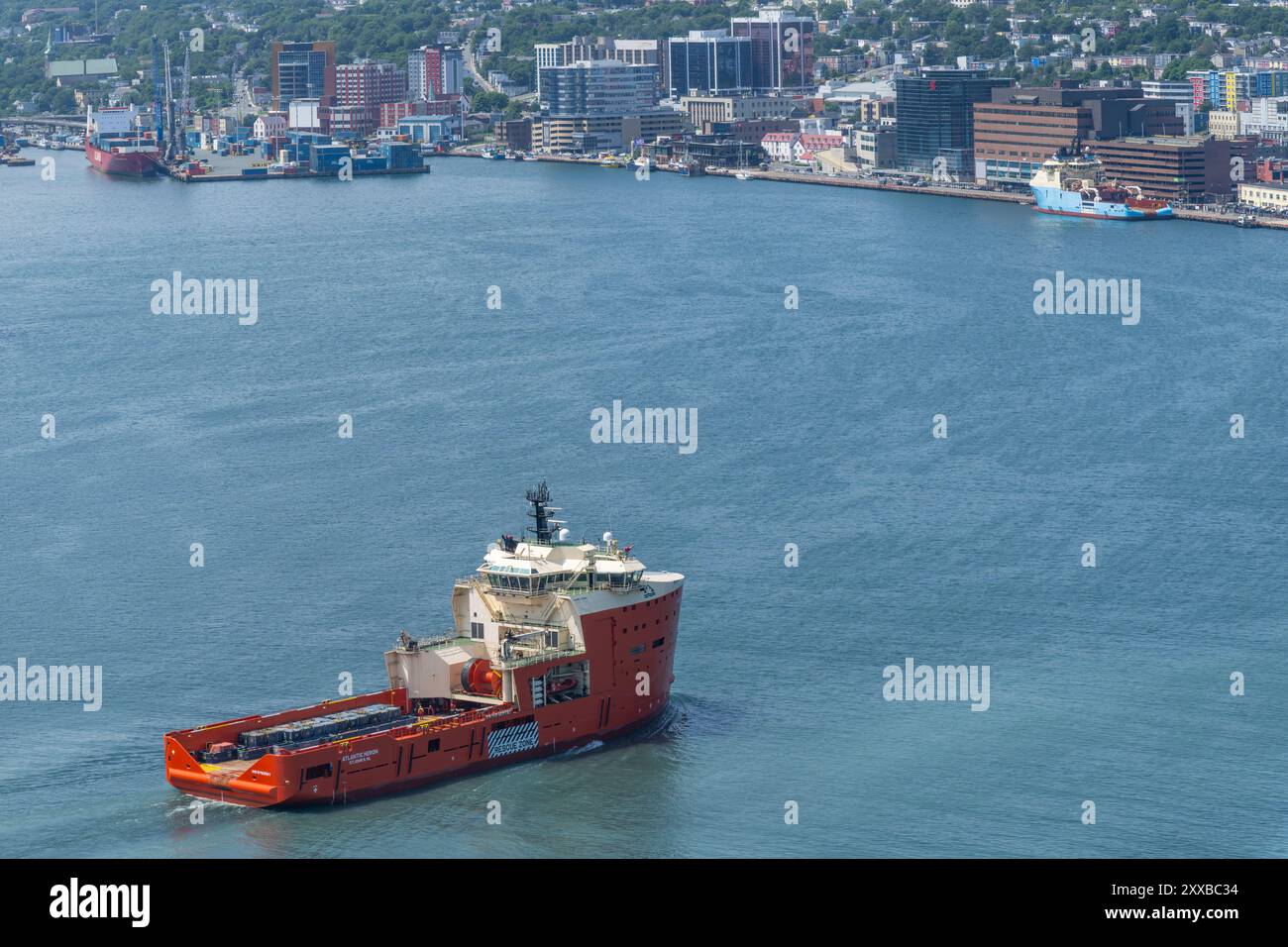 Wide angle view downtown St. John’s, ships, harbor, buildings, office ...