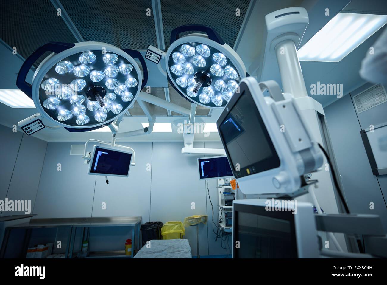 Empty operating room in a hospital with modern medical lamps Stock ...