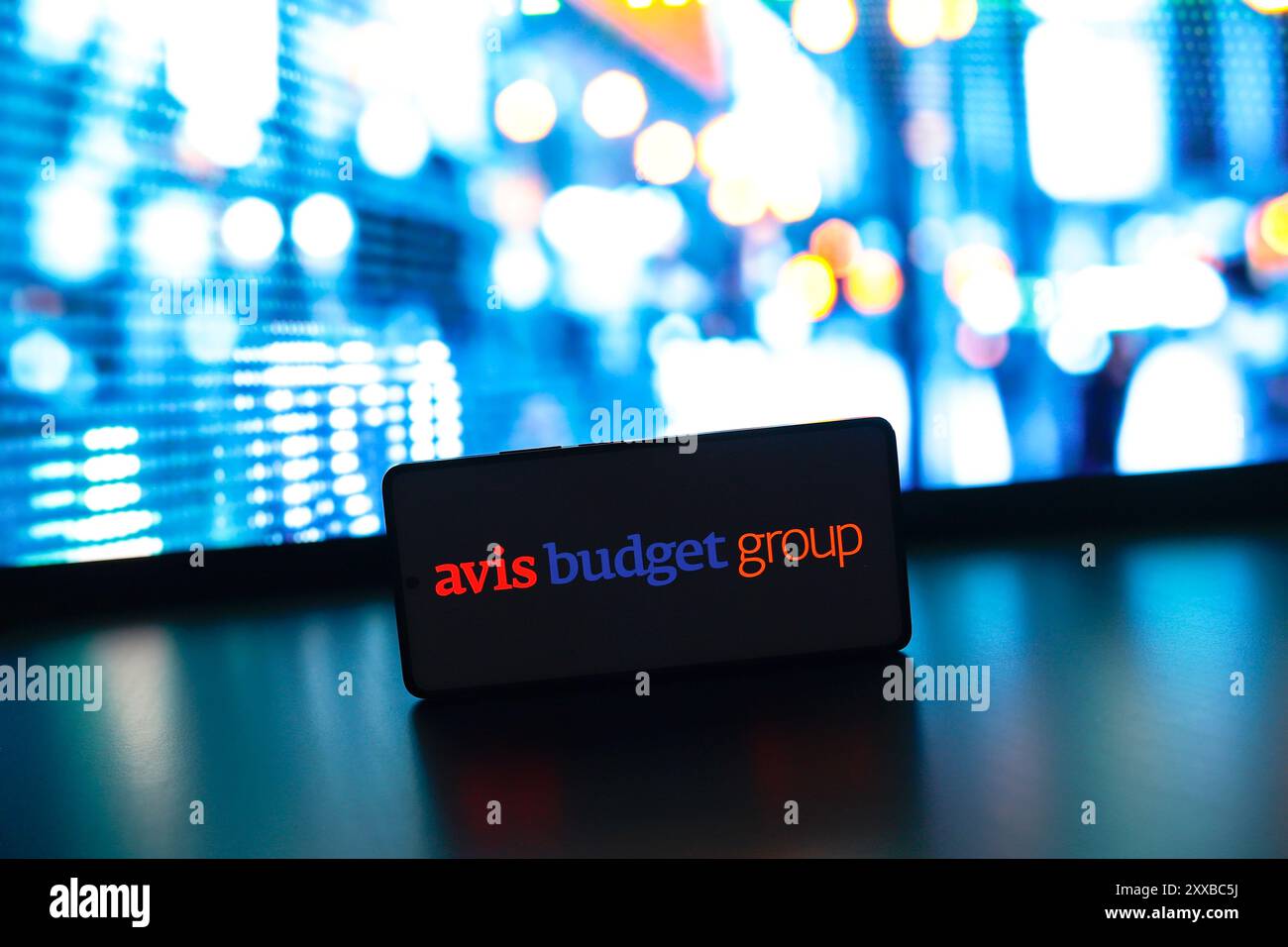In this photo illustration, the Avis Budget Group, Inc. logo is ...