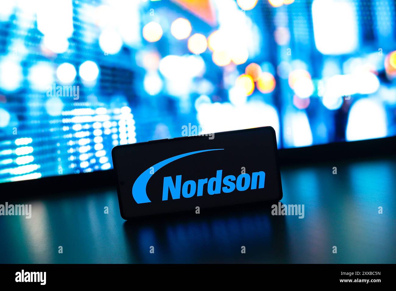 In this photo illustration, the Nordson Corporation logo is displayed ...