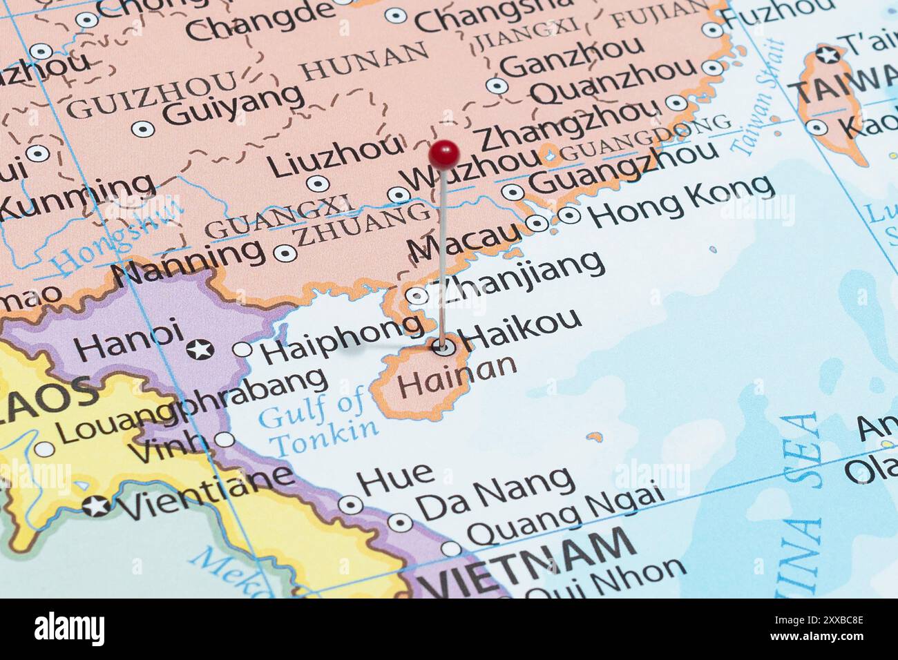 Close up to a Haikou city with a red pin needle into China country ...