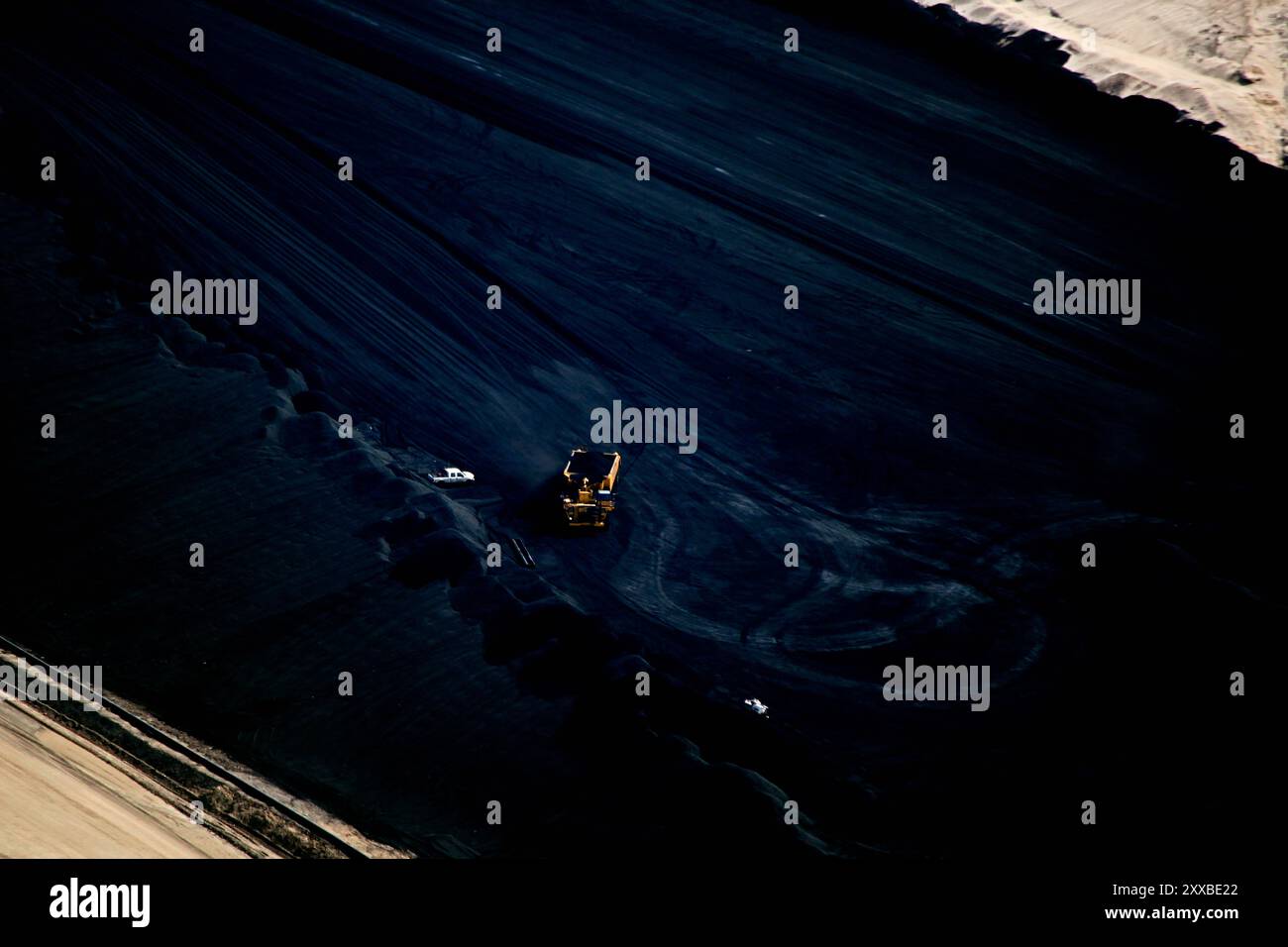 Bitumen rich oil sand is picked up for processing at one of the oil ...