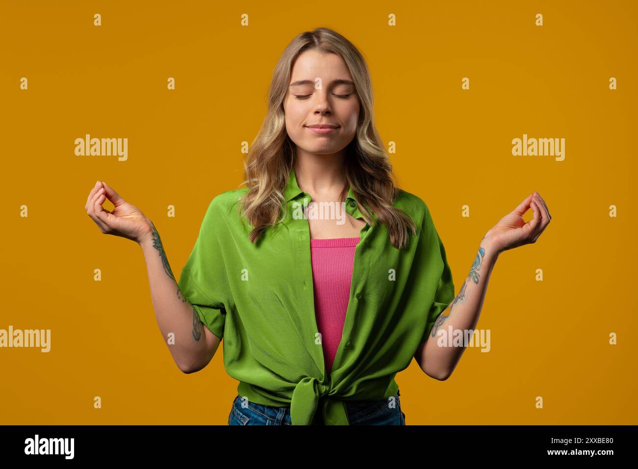 Calm woman relaxing, meditating, refuses stress. Blonde lady breathes ...