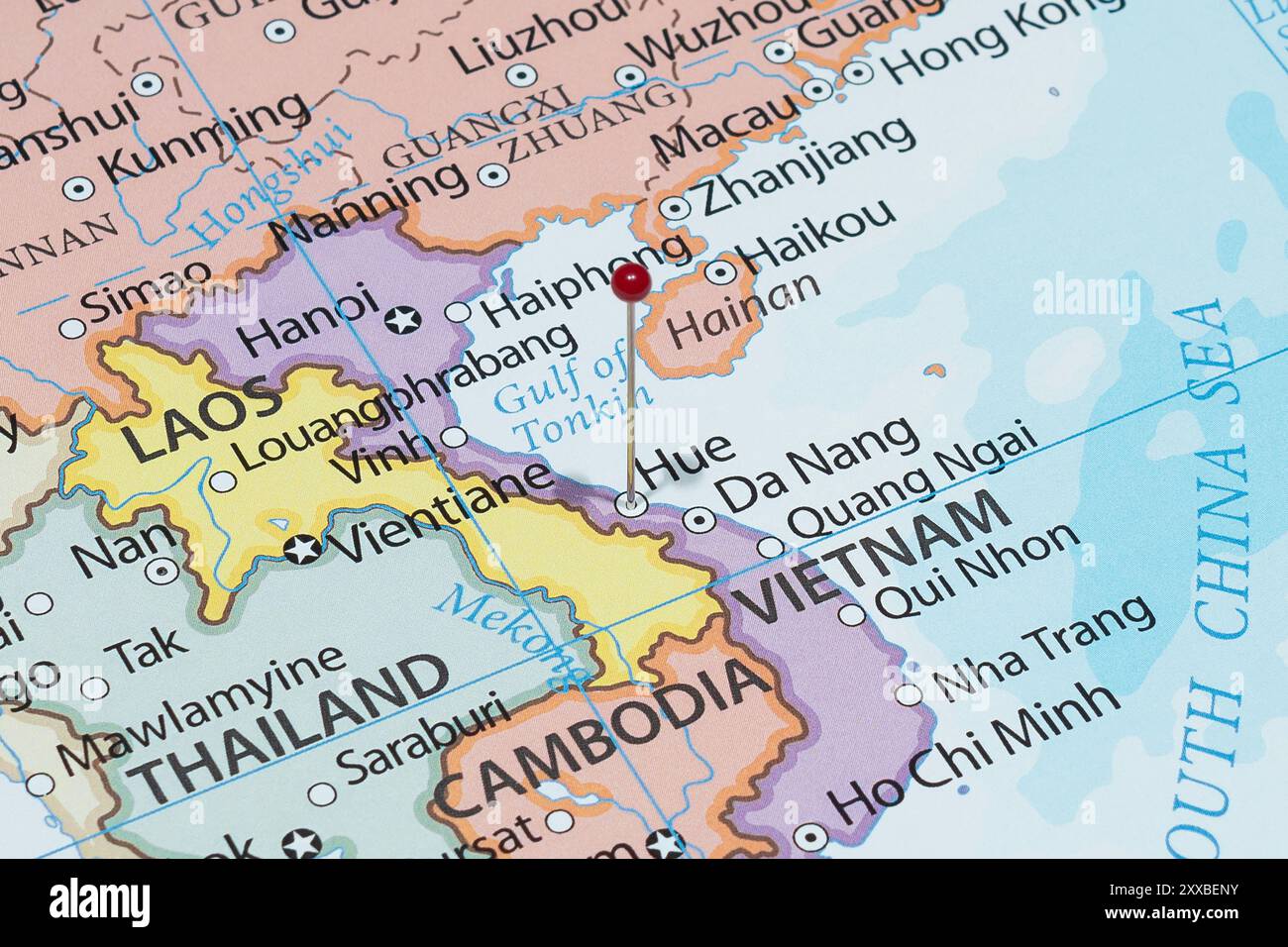Close up to a Hue city with a red pin needle into Vietnam country ...