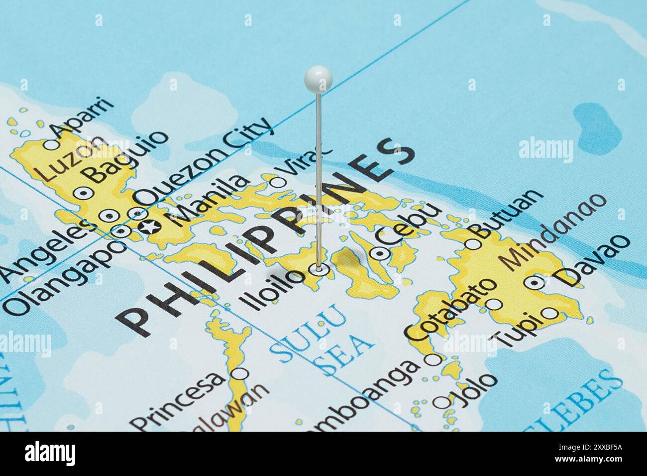 Close up to a Iloilo city with a white pin needle into Philippines ...