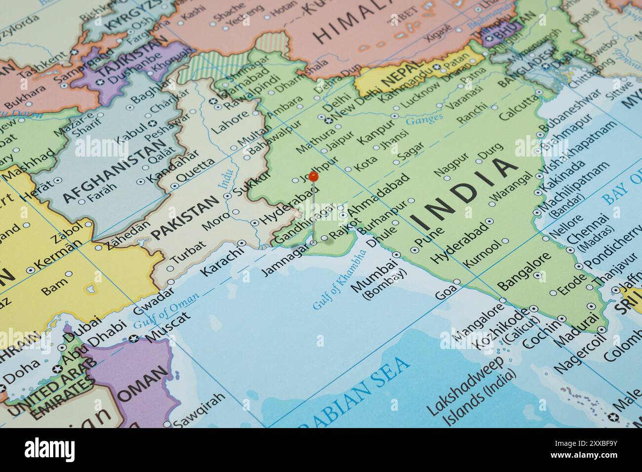 Close up to a Jamnagar city with an orange pin needle into India ...