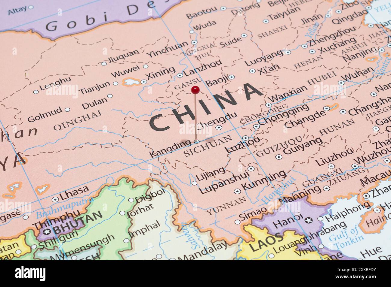 Close up to a Kangding city with a red pin needle into China country ...