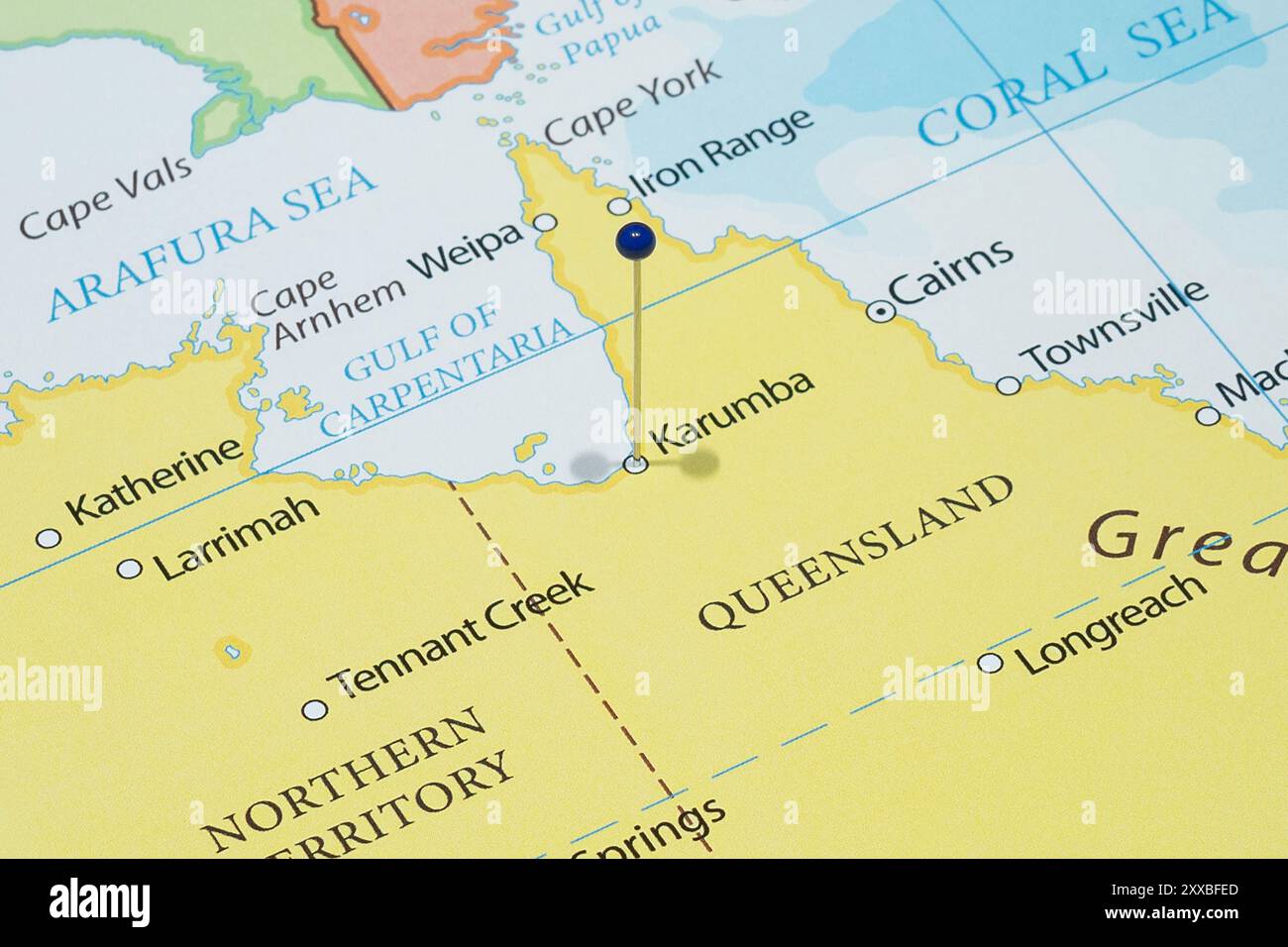 Close up to a Karumba city with a blue pin needle into Australia ...